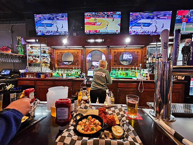 Behind the bar, where the magic happens. The refrigerators glow like beacons of refreshment after a long day.