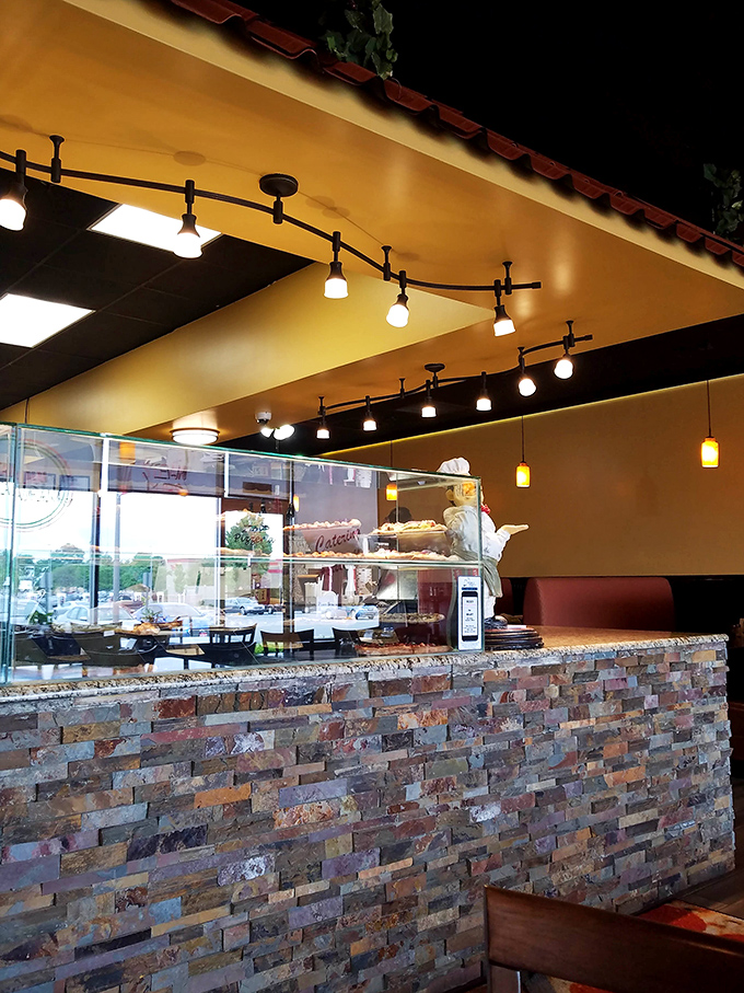 Track lighting illuminates the pizza-making stage. Good lighting is essential for both theater and exceptional Italian food.