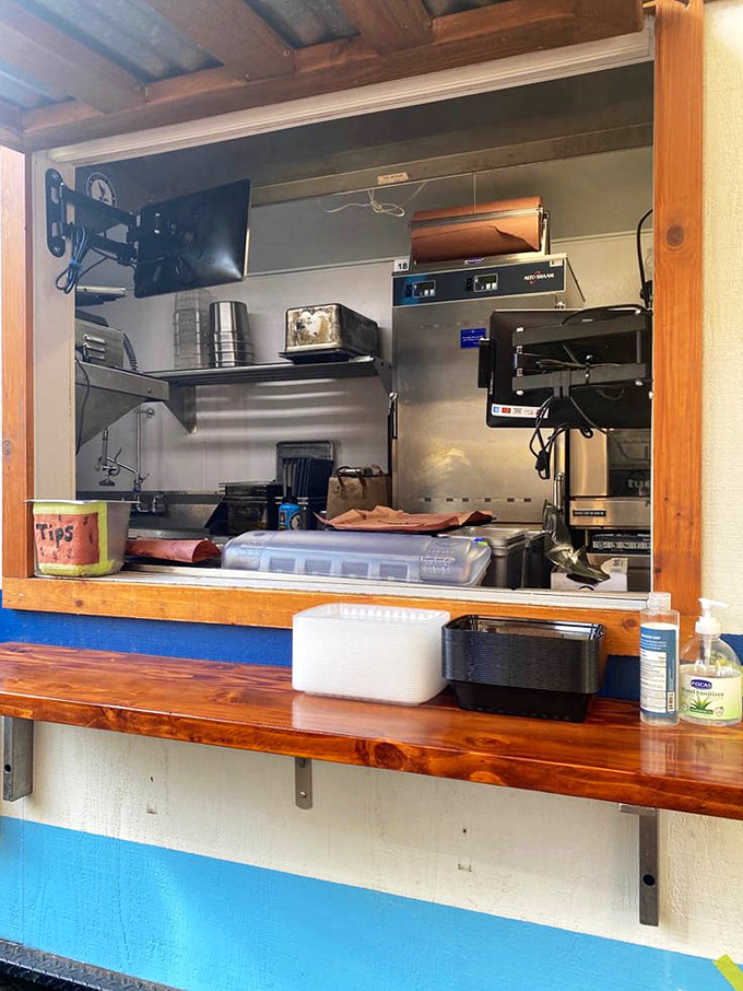 The service window&mdash;where anticipation meets fulfillment. That wooden counter has witnessed countless first-bite expressions of pure joy.