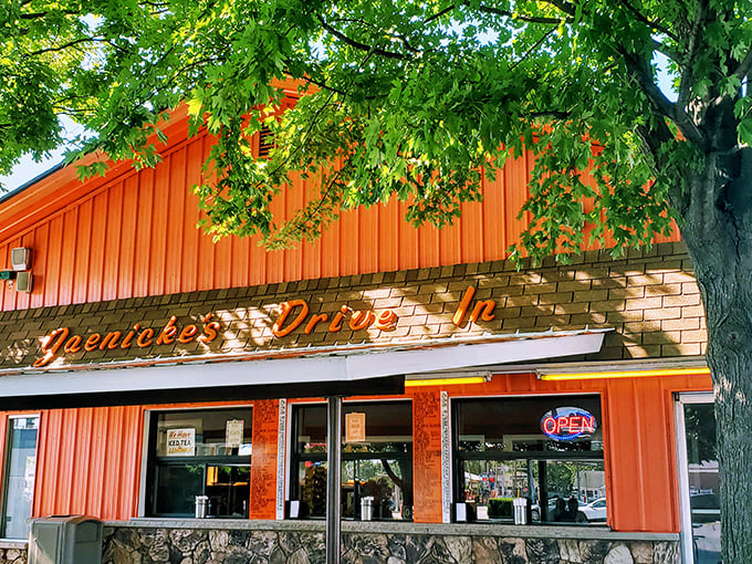 Three perfect ordering windows, framed by stone and that signature orange &ndash; the gateway to flavor town that doesn't need a flashy passport.