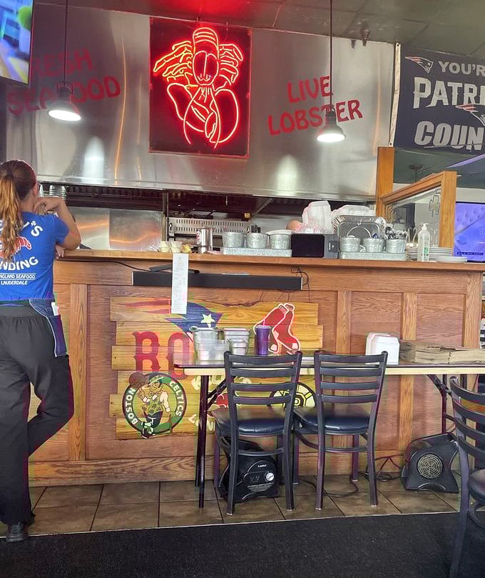 The kitchen window reveals the organized chaos where all the magic happens, one order at a time.
