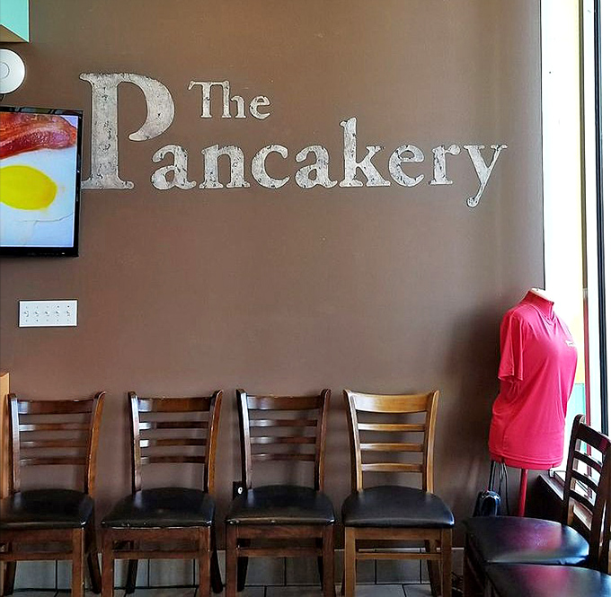 The restaurant's name emblazoned on the wall serves as both decoration and promise&mdash;this place takes its pancake responsibility seriously.