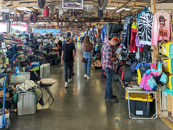 The treasure hunt in progress&mdash;shoppers navigating the indoor wilderness of possibilities, each aisle promising undiscovered bargains.