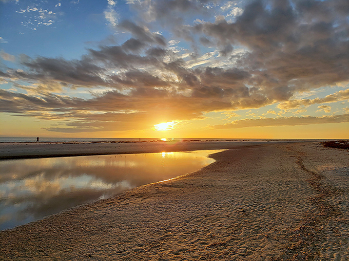 Mother Nature showing off again with a sunset that turns the shoreline into liquid gold&mdash;no filter required, just perfect timing.