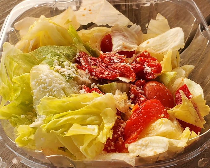 A garden salad that doesn't apologize for being healthy—bright, fresh, and adorned with roasted red peppers that add a sweet smoky punch.