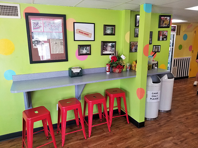 A splash of lime-green walls and cherry-red stools creates the kind of happy place where strangers become friends over shared fries.