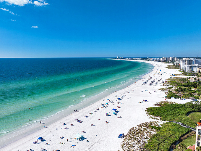 Siesta Key Beach stretches out like nature's welcome mat&mdash;powdery white sand meeting waters that shift from emerald to sapphire.