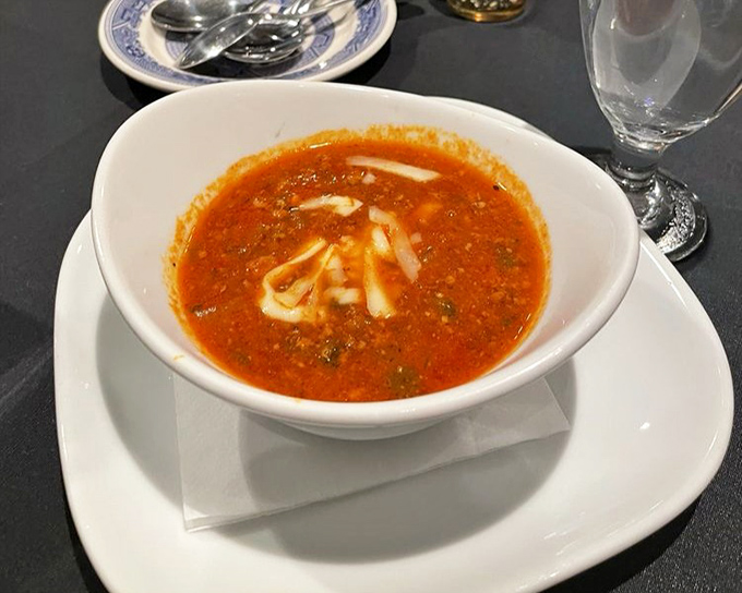 A soup that demands to be savored slowly. That swirl of cream isn't just garnish&mdash;it's an invitation to dive in spoon-first.