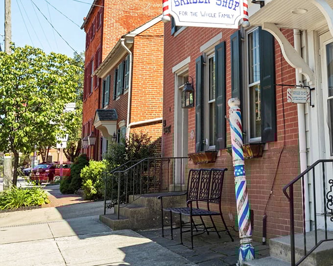 Barber pole poetry: South Duke Street's classic storefronts remind us that sometimes the best businesses don't need websites—just generations of satisfied customers.