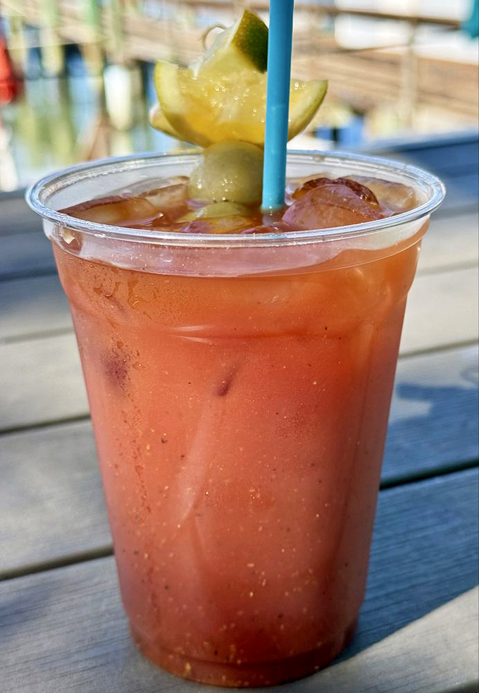 A Bloody Mary that means business. This spicy masterpiece comes garnished with a pickle, lime, and the promise of a very good afternoon.