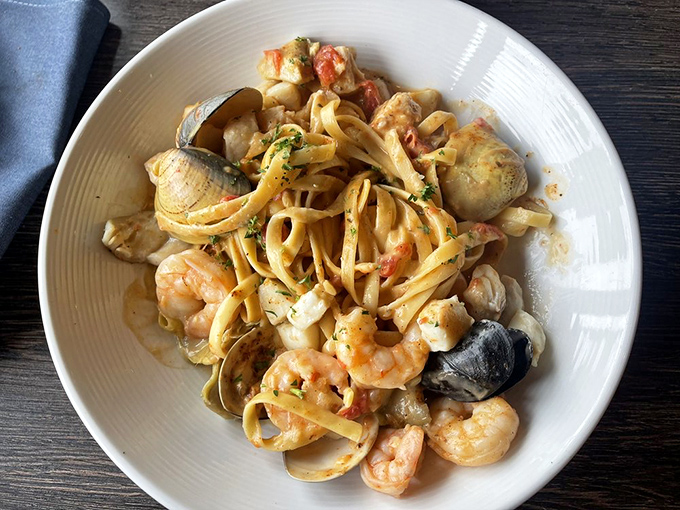 Spicy seafood pasta that's like an underwater party where everyone showed up&mdash;shrimp, clams, and mussels mingling in that vibrant sauce.