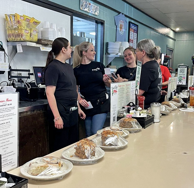 The real magic makers of West Side Cafe, sharing smiles and stories while keeping the coffee flowing and the plates full.