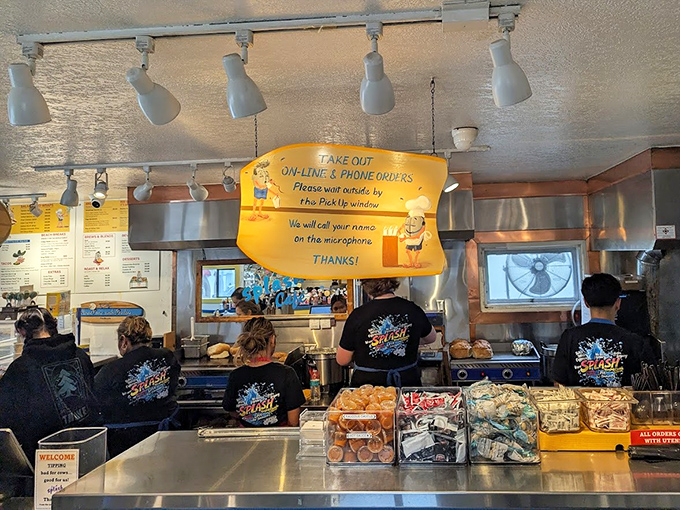 The pickup counter&mdash;where names are called and dreams come true. Those staff shirts have seen thousands of "first bite" faces.