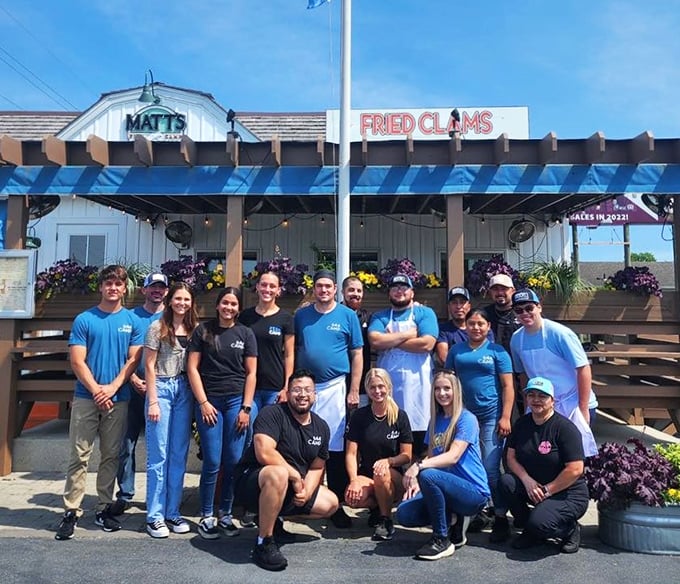 The team behind the magic&mdash;proof that great seafood requires both skill and the kind of smiles that suggest they know exactly what they're serving.