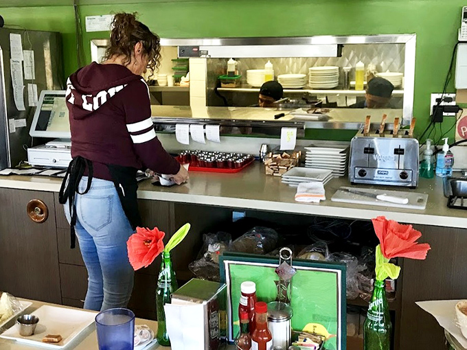 Behind the scenes, the staff orchestrates the breakfast ballet with practiced precision. Every plate a performance, every order a carefully choreographed routine.