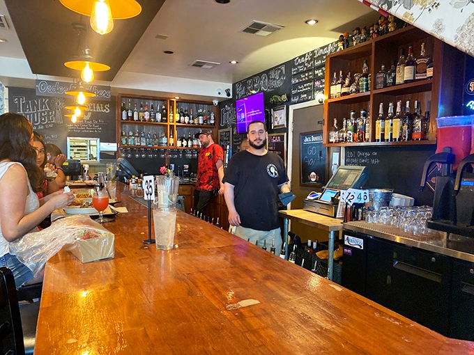 Behind the bar, where liquid happiness flows freely and the extensive whiskey collection makes choosing almost as difficult as deciding between brisket and ribs.