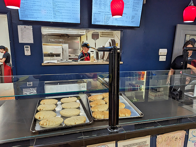 The calzone display case &ndash; showcasing pockets of joy waiting to release their cheesy secrets with each satisfying bite.