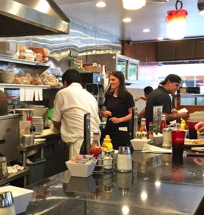 Behind the scenes, the kitchen crew orchestrates breakfast like a well-rehearsed symphony, with spatulas as their batons.