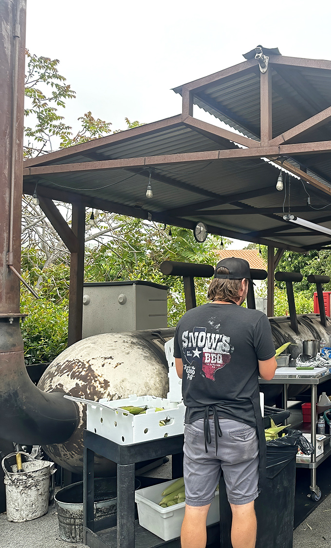 Behind every great barbecue is someone tending the fire with monk-like dedication. This isn't cooking; it's a calling.