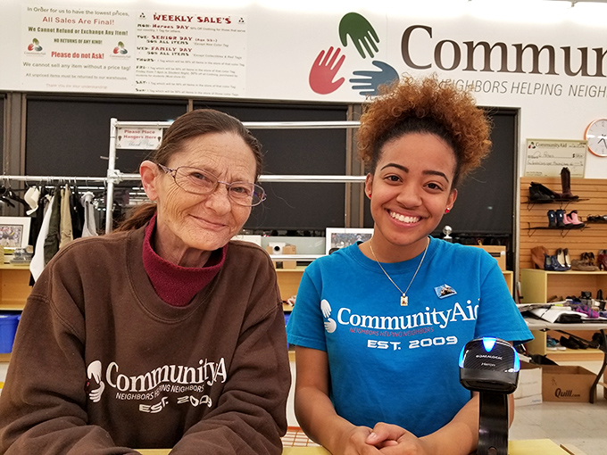 The friendly faces of CommunityAid embody the "neighbors helping neighbors" philosophy that turns simple shopping into community building.