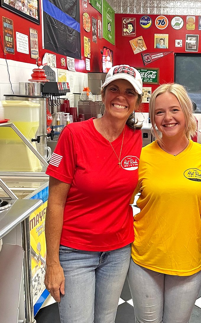 The smiles of diner staff who know they're serving happiness, not just food. Their t-shirts match the walls&mdash;commitment to theme!
