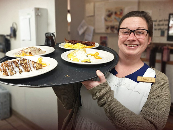 The smile says it all&mdash;when your server looks this happy about the food they're carrying, you know you're in for something special.