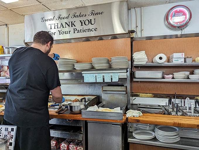 The unsung heroes of breakfast, working their morning magic. That sign politely reminds us that perfection can't be rushed.