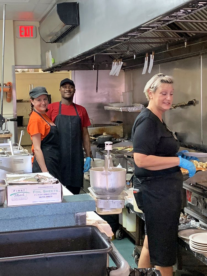 The real magic happens behind the scenes, where skilled hands transform simple ingredients into memorable meals with practiced efficiency.