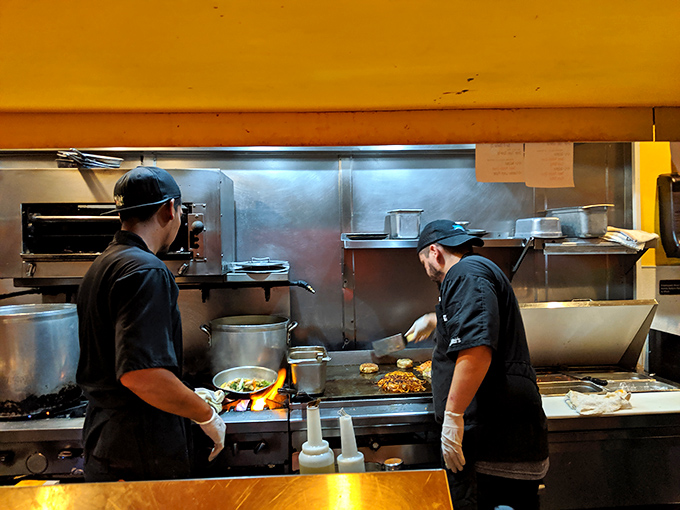 The open kitchen lets you watch culinary magic happen in real time. No smoke, no mirrors, just serious cooking skills.