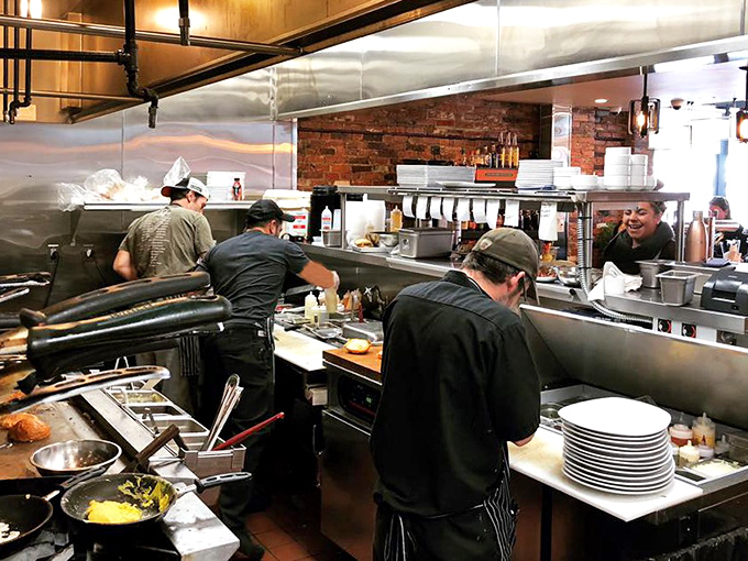 Behind the scenes, the kitchen crew orchestrates the smoke and fire with the precision of a well-rehearsed symphony. This is where the magic happens.