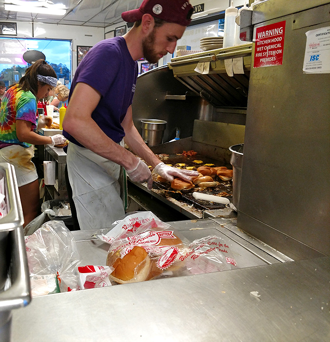 Behind the scenes, the choreographed dance of burger-making unfolds&mdash;where tradition and technique meet on a well-seasoned grill.