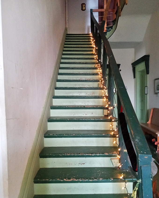 These stairs have carried generations of footsteps, each one adding another layer to this mansion's rich tapestry.
