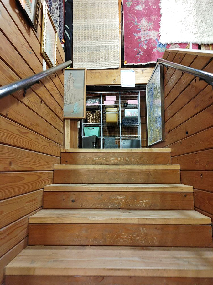 Wooden stairs lead to more discoveries upstairs. Like Alice's rabbit hole, but with better lighting and vintage treasures instead of talking cards.