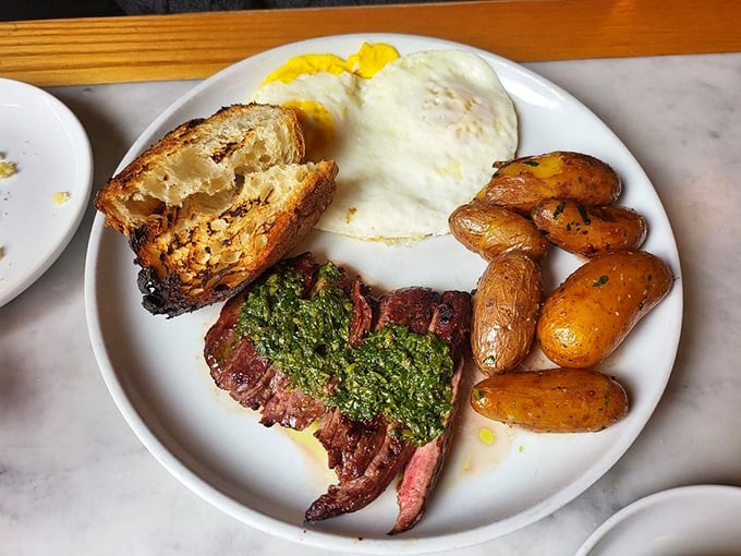 Steak and eggs: the power breakfast of champions. That pesto adds a splash of color that says, "I'm sophisticated, but approachable."