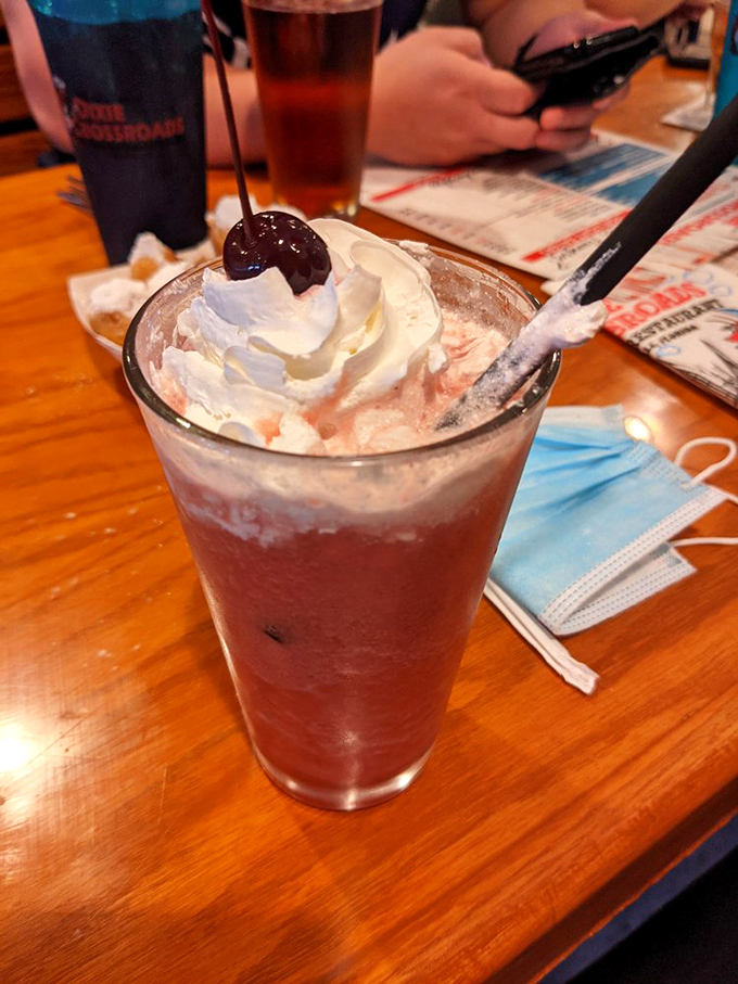 The strawberry daiquiri: dessert masquerading as a beverage. That whipped cream crown makes it practically a food group all its own.