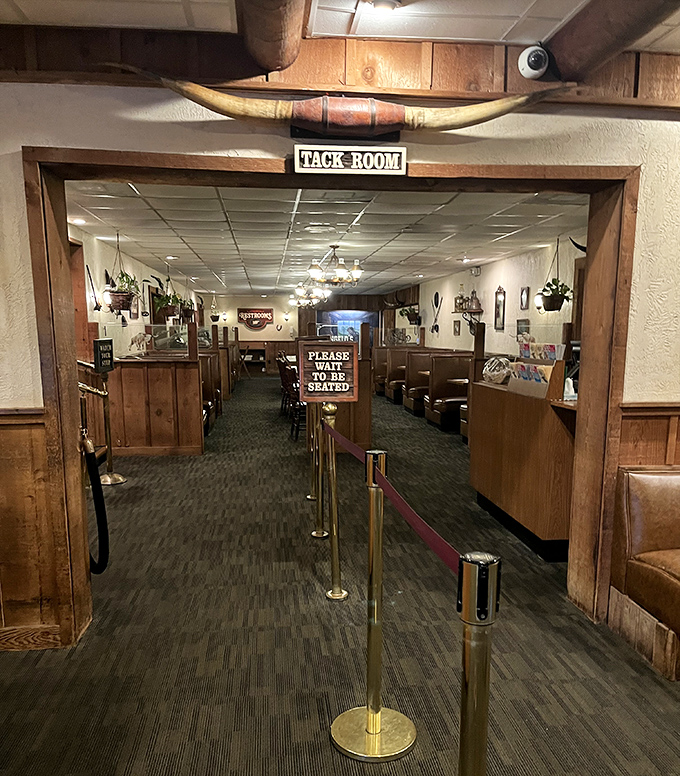 The "Tack Room" entrance promises an authentic steakhouse experience. No pretension here—just the promise of serious meat in your future.