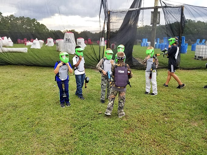 Paintball warriors-in-training gather for battle instructions, proving that suburban combat is alive and well in North Florida's recreational landscape.
