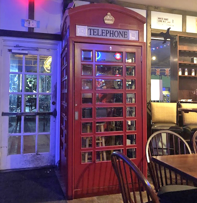 The classic red telephone booth stands ready for your obligatory "Yes, I'm calling from Britain" photo op. No coins required!