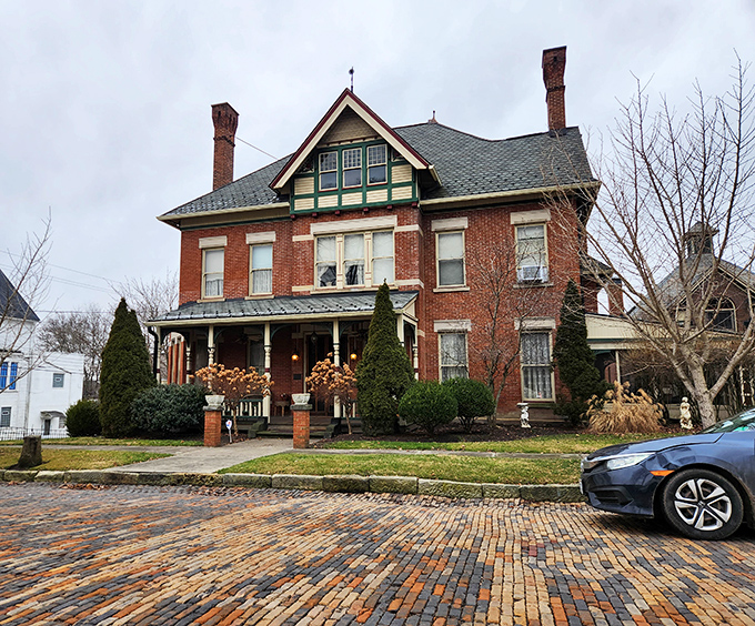 The Russell House stands as a testament to Victorian craftsmanship, complete with brick streets that make your tires sound like they're applauding.