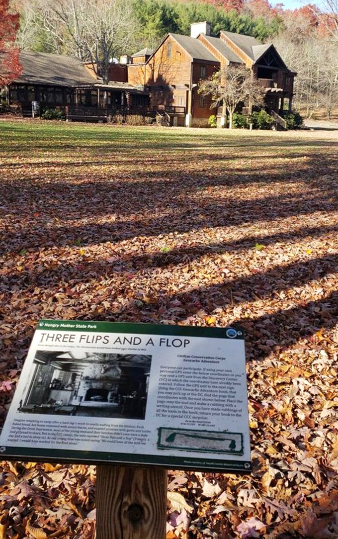 The interpretive sign reveals fascinating CCC history while autumn leaves provide the perfect educational carpet underfoot.