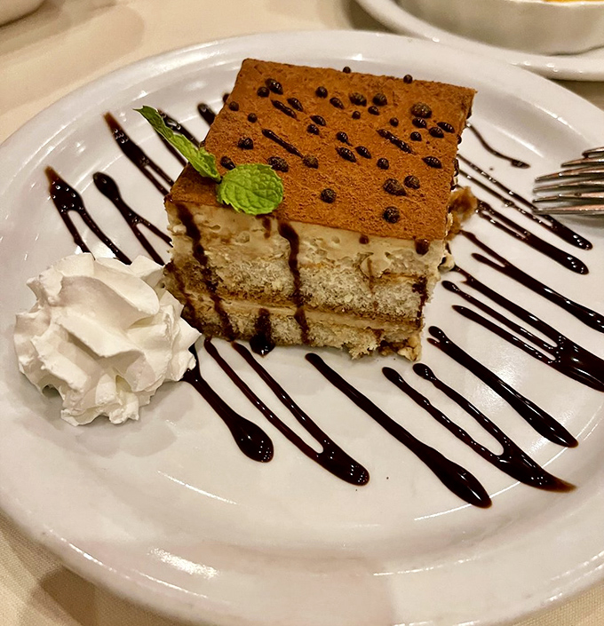 Tiramisu with architectural precision. Those layers aren't just dessert—they're edible art that somehow tastes even better than it looks.