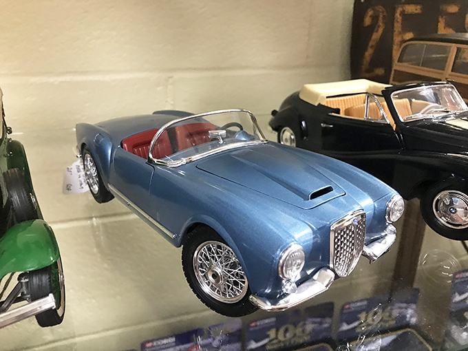 Miniature automotive masterpieces await collectors behind glass, proving that sometimes the most perfect cars are the ones that fit in your palm.