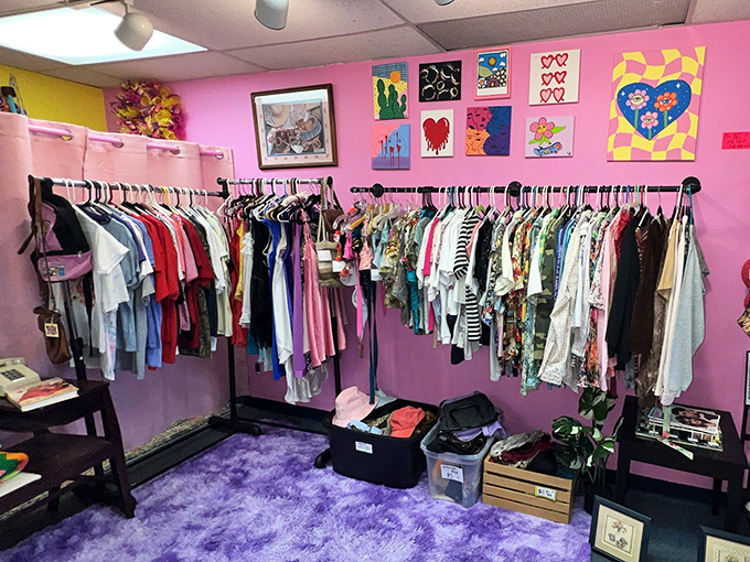 Purple walls and plush carpet create a boutique vibe in this clothing nook. Thrifting elevated from necessity to delightful pastime.