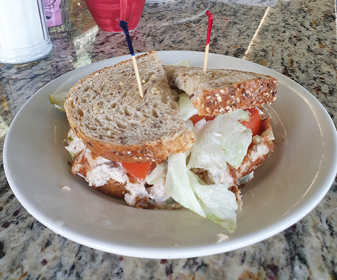 A sandwich that understands the importance of proper bread-to-filling ratio, served with a side of nostalgia and crisp lettuce.
