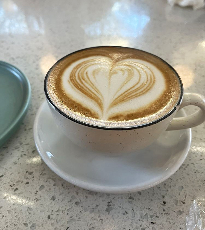 Latte art so pretty you almost don't want to drink it. Almost. That heart says "I was made with care" in the universal language of coffee.