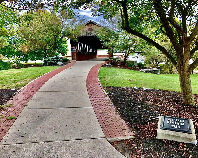 The Veterans Memorial Walk provides a shaded path to a covered bridge, honoring service while creating picturesque spots for morning constitutionals.