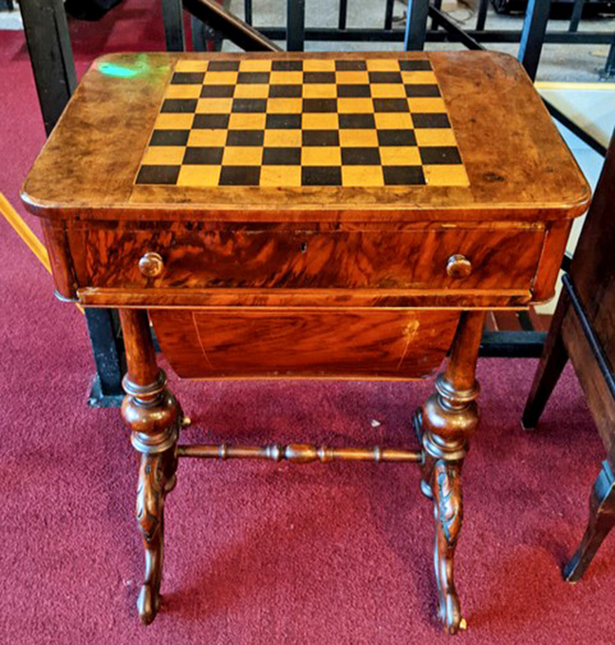 Victorian game table that's hosted more strategic battles than the Pentagon. That checkerboard top is ready for your next chess match or afternoon tea.