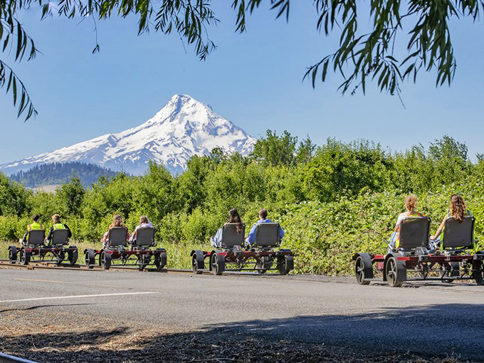 Mount Hood stands sentinel over rail bikers, offering the kind of backdrop that makes amateur photographers look professional.