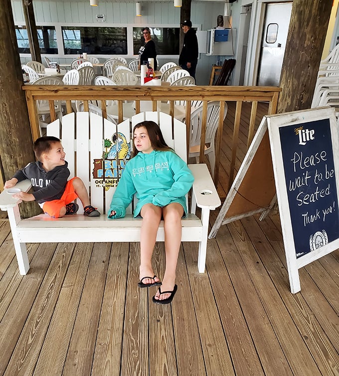 The waiting area doubles as a photo op&mdash;that bench with the Blue Parrot logo has starred in more family vacation albums than most celebrities' red carpets.