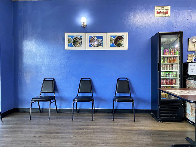 Minimalist waiting area that says, "We put our energy into the food, not fancy chairs." The anticipation makes it comfortable enough.